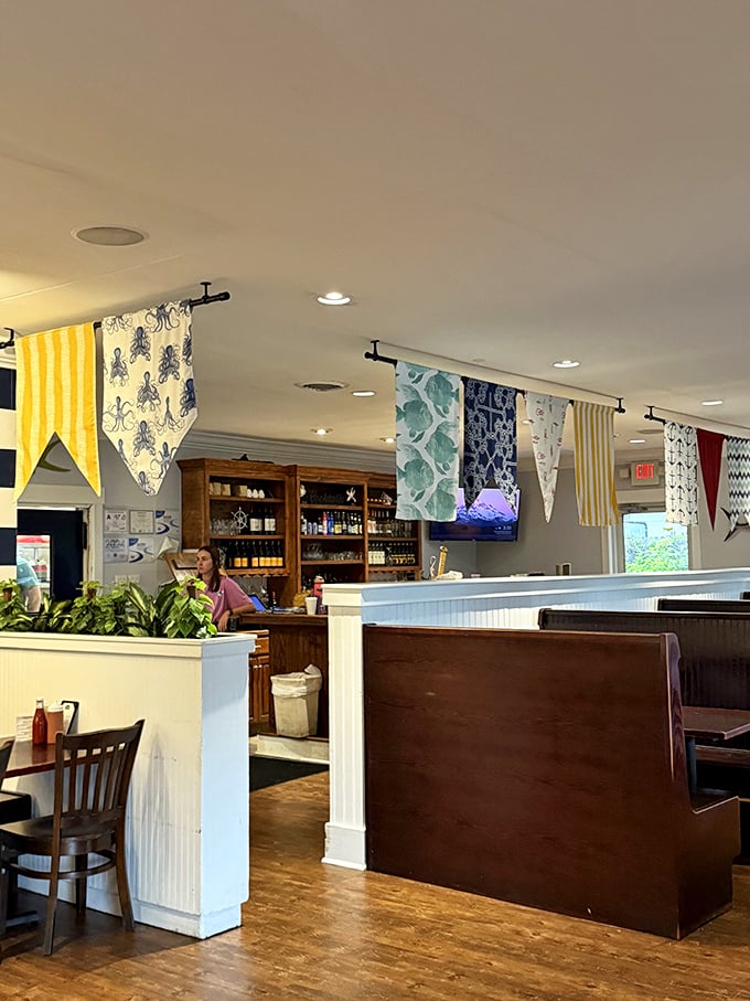 Colorful nautical pennants flutter overhead, creating a festive atmosphere that says "celebration" before you even order.