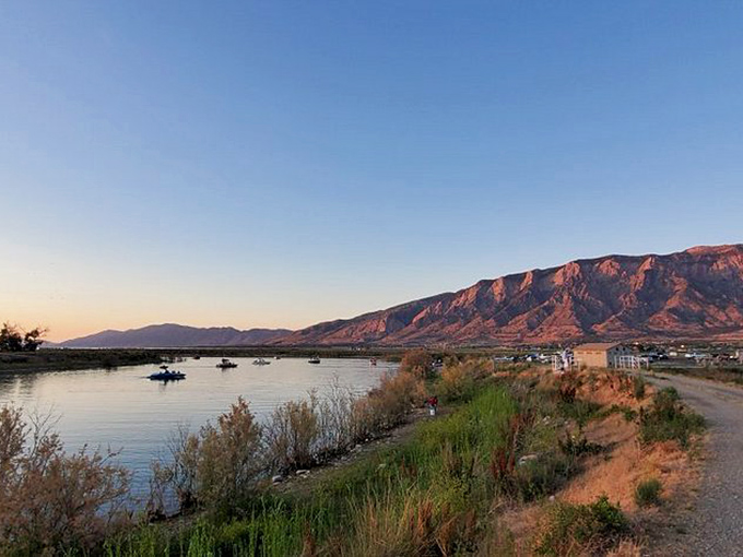 Twilight magic hour at the marina&mdash;when boats become silhouettes, mountains blush pink, and you realize why people write songs about places like this.