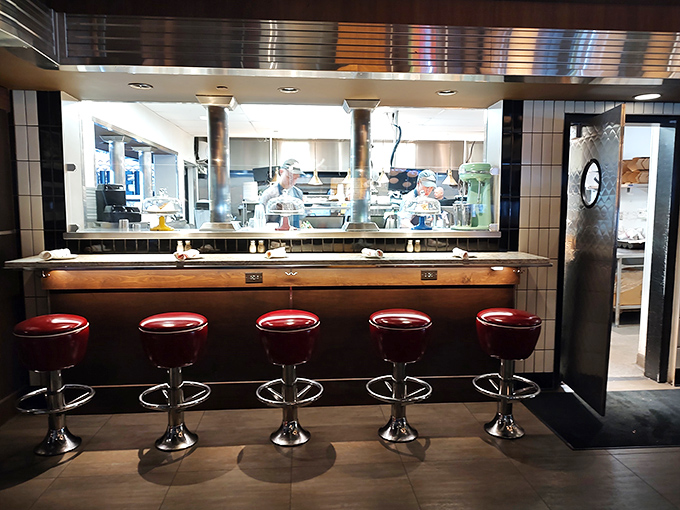 Counter seating offers front-row views to culinary theater – where diner classics are performed with fine-dining precision.