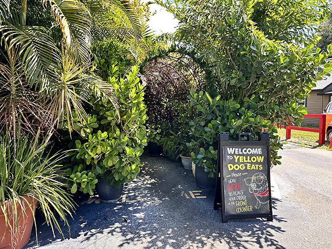 The garden entrance welcomes visitors through a verdant archway&mdash;nature's way of saying "abandon your diet, all ye who enter here."