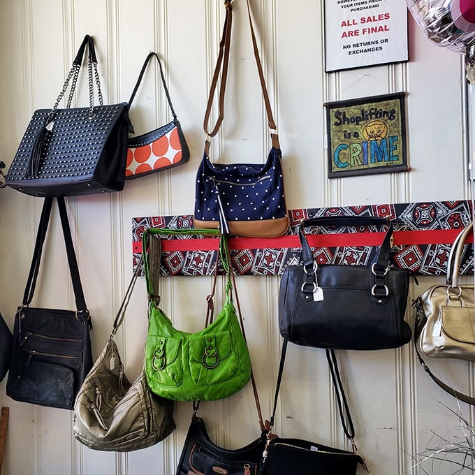 The handbag wall of fame. That lime green purse is making a statement, and the statement is "I have personality and excellent taste in bargains."