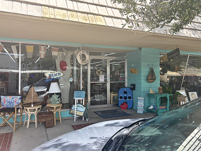 Bay Breeze Antiques spills its coastal treasures onto the sidewalk, a delightful jumble of maritime memorabilia where someone else's memories become your souvenirs.