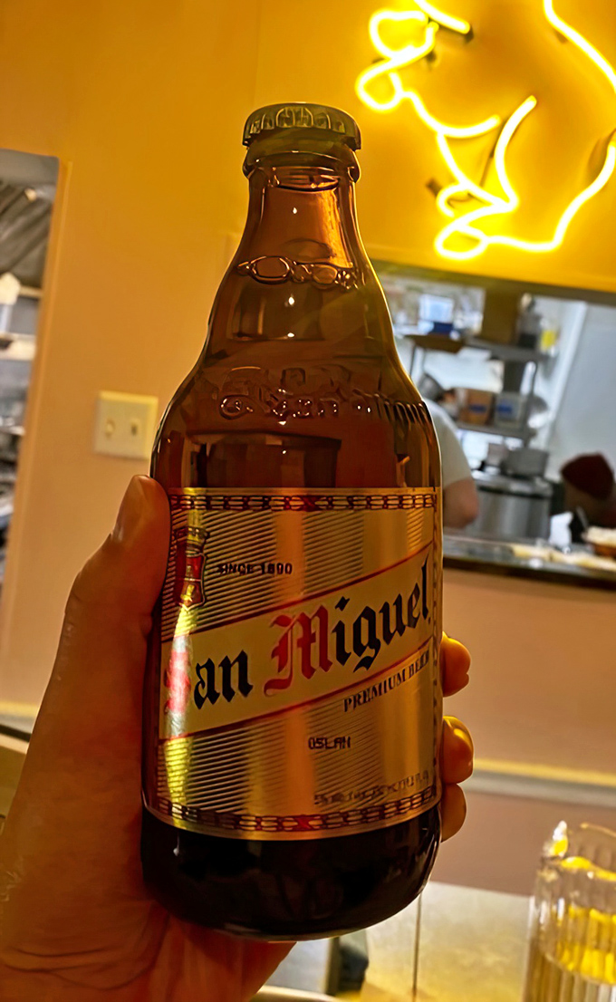 San Miguel beer&mdash;the perfect liquid companion to cut through rich flavors and remind you that sometimes the simplest pleasures are the best.