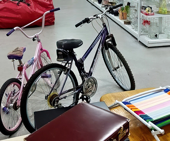 Bicycles and briefcases sharing floor space&mdash;transportation and work essentials that prove "pre-owned" doesn't mean "past its prime."