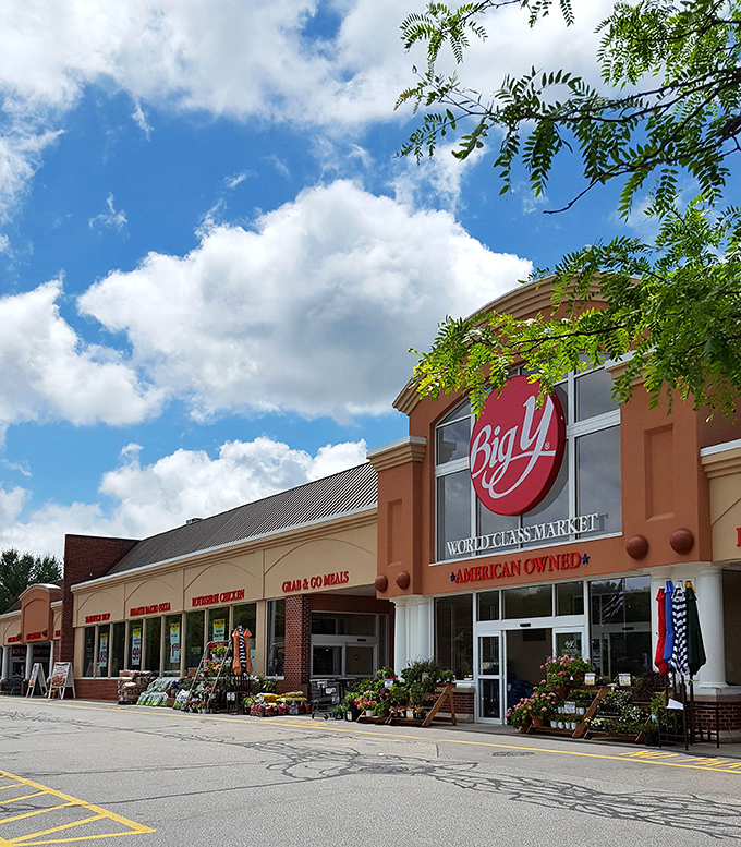Big Y's summer display bursts with flowers and patriotic flair. Grocery shopping becomes less chore, more sensory experience under Connecticut's blue skies.
