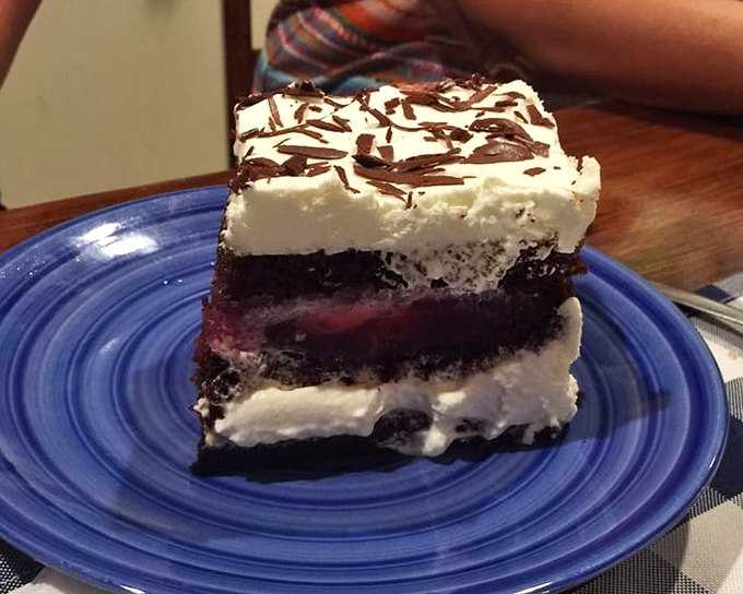 Layers of chocolate cake, cream, and cherry filling create this Black Forest masterpiece that's almost too beautiful to eat.