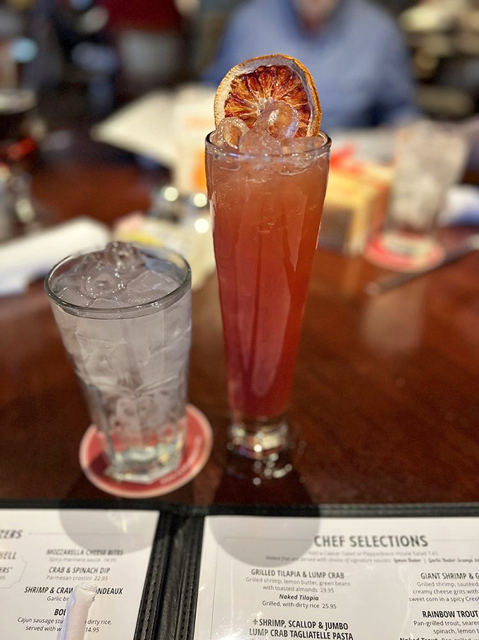 This cocktail isn't just a drink; it's a sunset in a glass, complete with a caramelized citrus garnish that's basically jewelry for your beverage.