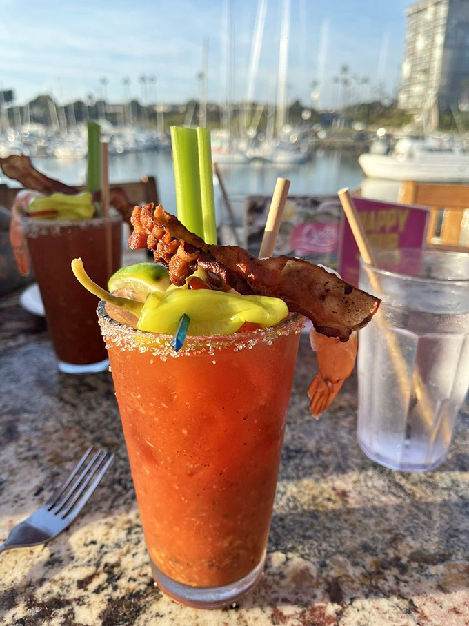 A Bloody Mary with harbor views and a bacon garnish &ndash; because sometimes your drink deserves its own appetizer.