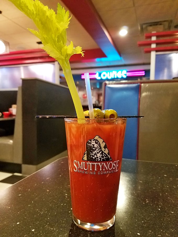 A Bloody Mary that's practically a meal, complete with its own garden. The "Lounge" sign in back knows exactly what you're thinking.