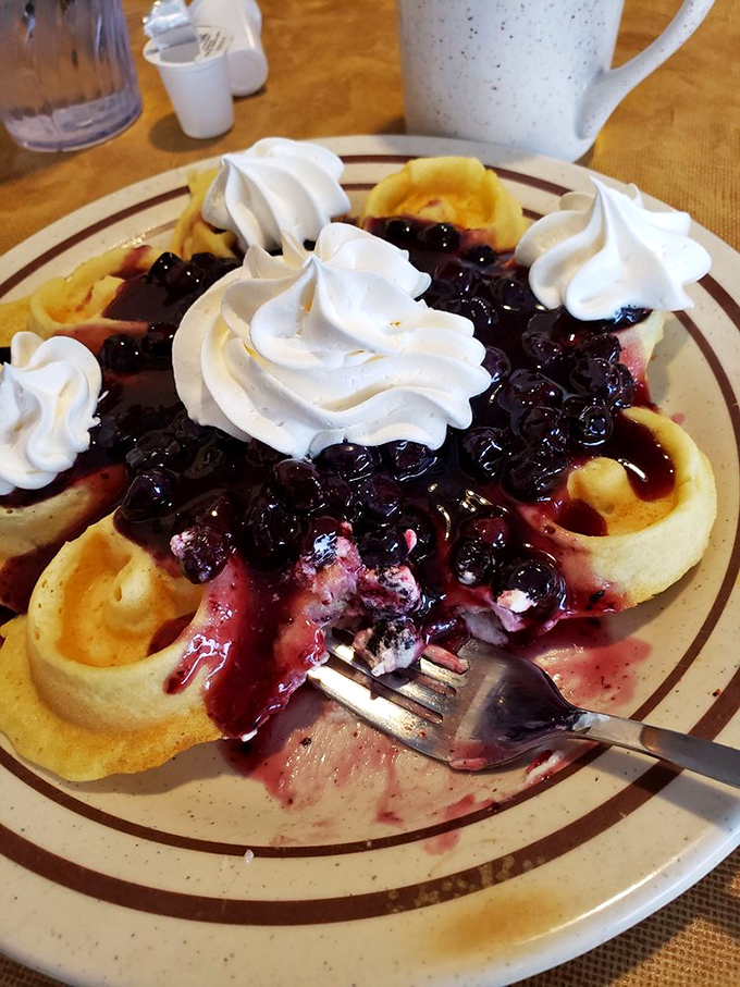 Waffles topped with blueberries and whipped cream &ndash; breakfast's way of saying "you deserve something special today."