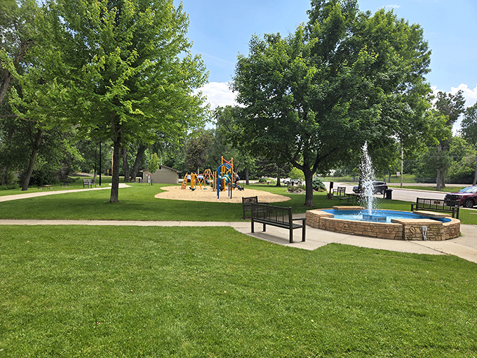Brady Park's fountain creates the perfect soundtrack for summer afternoons. Kids play, parents relax, and everyone pretends they're not melting.