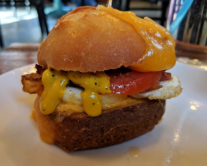 Breakfast sandwich architecture at its finest. The egg and cheese cascade like a sunrise over the perfect morning horizon of freshly baked bread.
