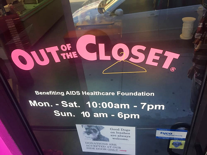 Dog-friendly thrifting with a mission. The store hours sign welcomes both bargain hunters and their four-legged shopping assistants.