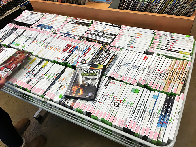 Gaming goldmine! These carefully organized discs represent thousands of hours of entertainment, each plastic case a portal to digital adventures past.