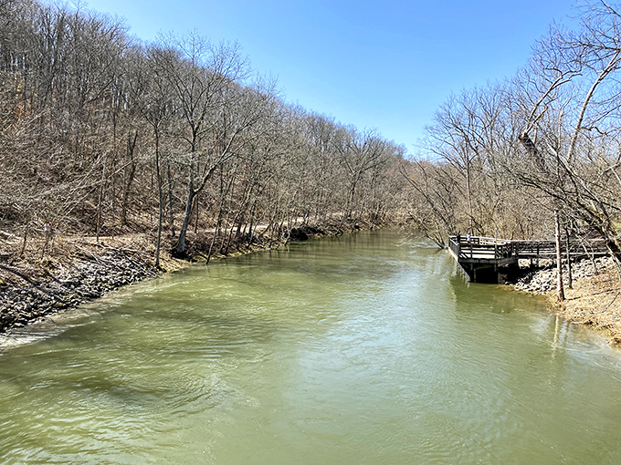 Early spring reveals the creek's quiet power. This peaceful scene belies the engineering marvel that transformed a humble waterway into Ohio's aquatic playground. 
