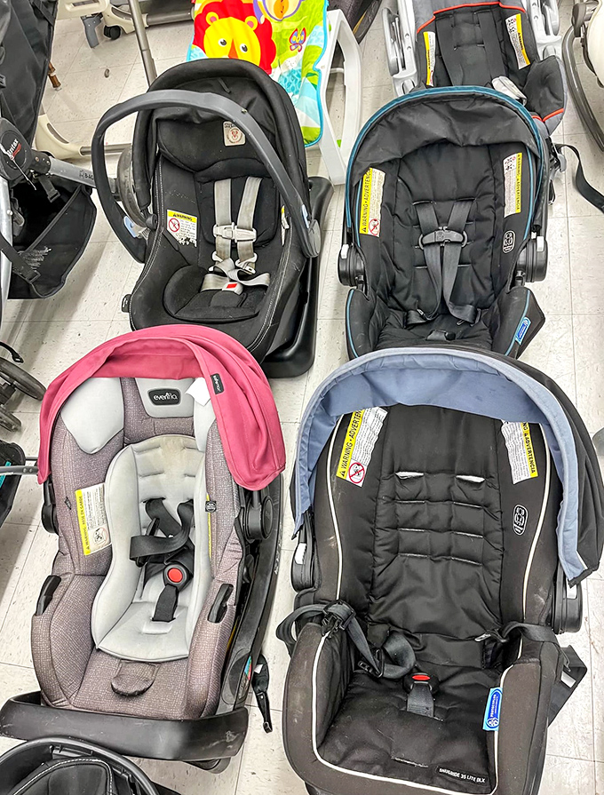 Nearly-new car seats lined up like NASA mission control chairs, ready to safely transport the next generation without breaking the family budget.