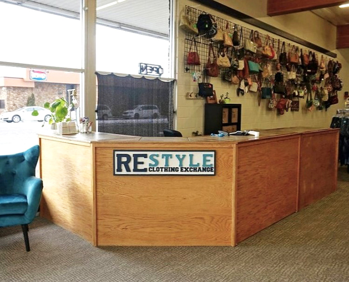 The warm wooden checkout counter, where fashion treasures officially become yours without emptying your wallet.