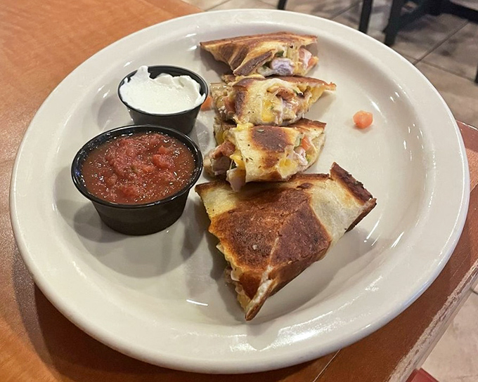 These quesadillas tell the timeless story of cheese meeting tortilla, with supporting characters of salsa and sour cream waiting in the wings.