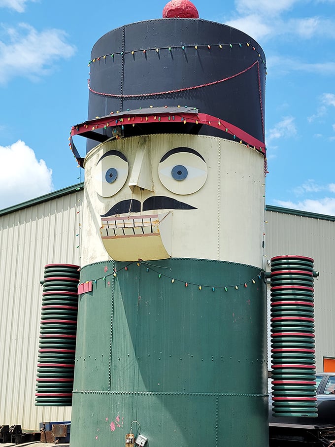 The red pom-pom atop the nutcracker's hat adds a jaunty finishing touch to this towering testament to roadside creativity.