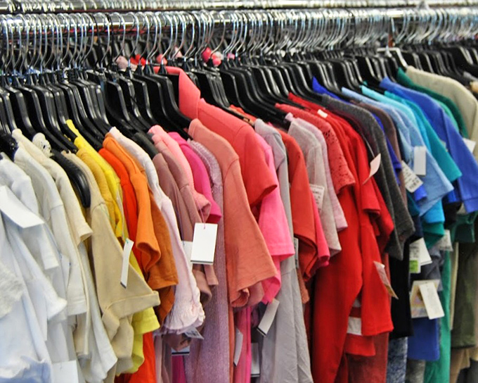 The rainbow of recycled fashion. Each hanger holds not just clothing, but the possibility of finding that perfect piece you never knew you needed.