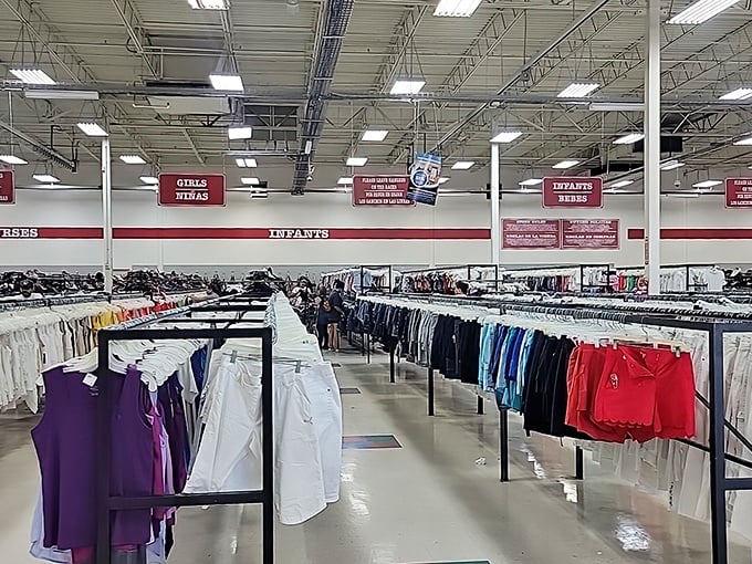 Clothing organized with military precision creates aisles that seem to extend into another dimension of fashion possibilities.