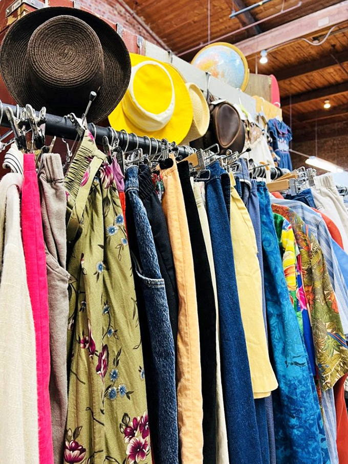 Vintage clothing racks where every piece tells a story. That mustard yellow dress might have danced at Woodstock&mdash;or at least wishes it had.