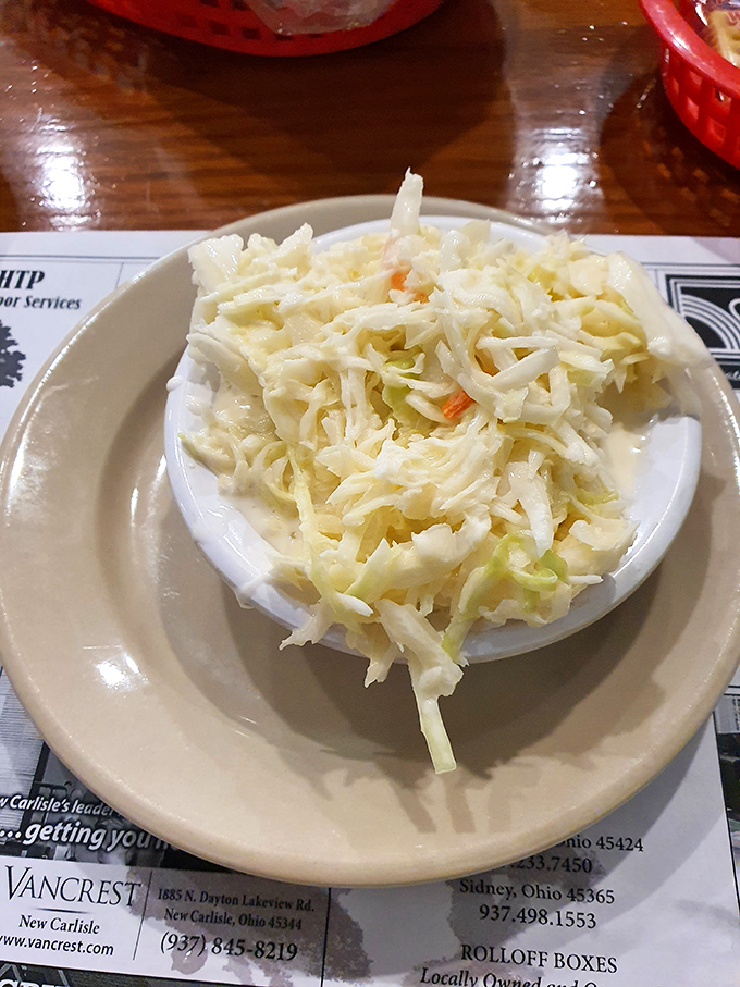 This isn't just coleslaw; it's the perfect cool, creamy counterpoint to the hearty mains&mdash;a supporting actor that sometimes steals the show.