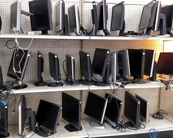 Monitor madness! For tech tinkerers and budget home office builders, this wall of screens offers digital possibilities at analog prices.