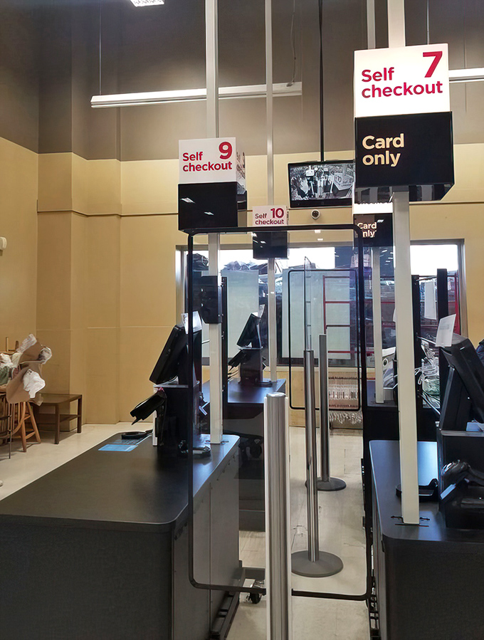 Self-checkout stations stand ready for your treasure haul. The final step in your thrifting adventure before heading home victorious.