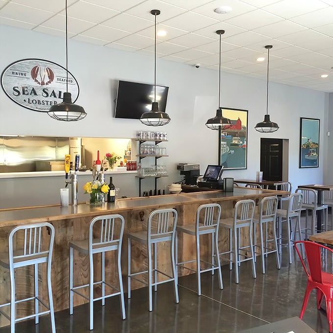 The wooden bar invites solo diners and couples alike to perch, sip, and savor while watching the orchestrated dance of a professional kitchen.