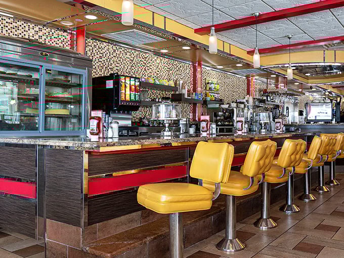 Those mustard-yellow counter stools aren't trying to be Instagram-famous; they're too busy supporting decades of elbows, conversations, and satisfied sighs.
