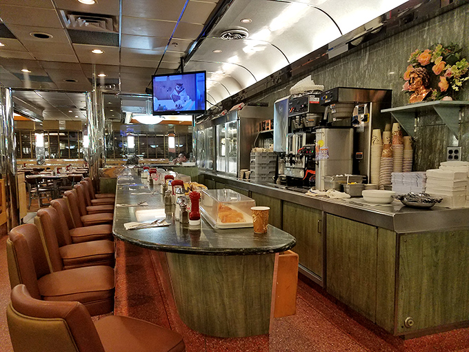The counter—where solo diners find community, regulars have their "usual" ready before they sit, and the true heartbeat of diner culture plays out daily.