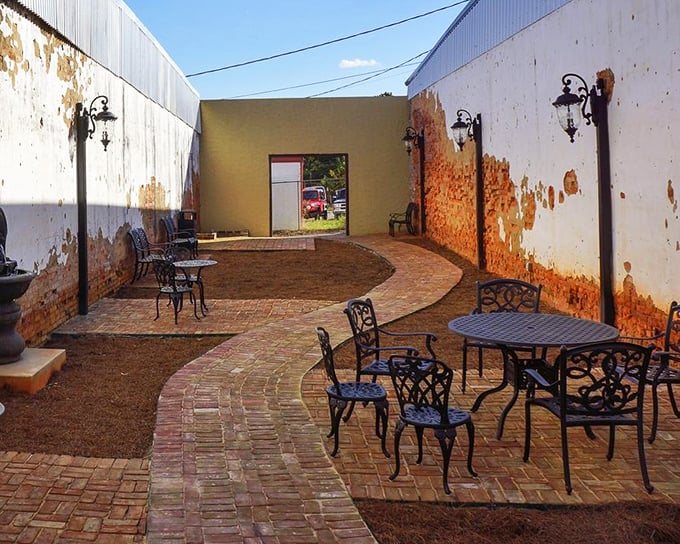 This brick-paved courtyard offers a quiet moment of reflection, where rustic walls tell stories if you're patient enough to listen.