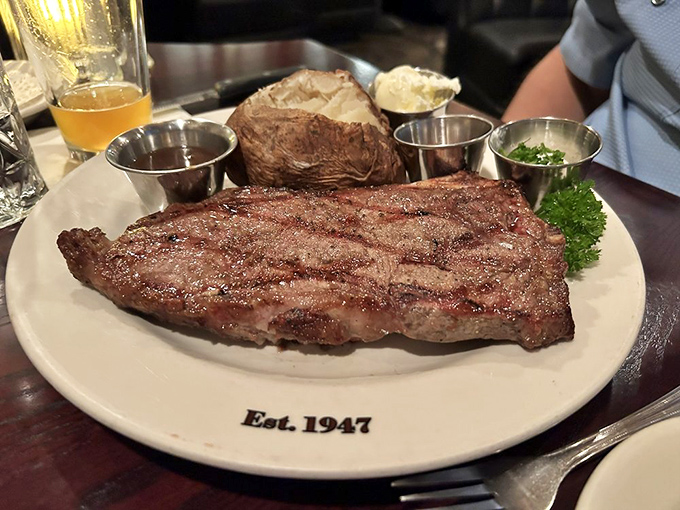 A Delmonico steak that commands respect and its own zip code. Paired with a baked potato that's dressed better than most people at the mall.