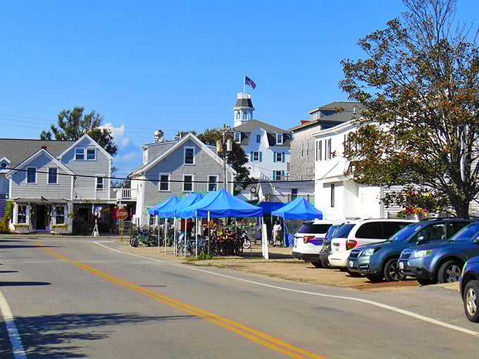Downtown New Shoreham on market day&mdash;where locals and visitors mingle under blue tents. The perfect place to discover island-made treasures and fresh produce.
