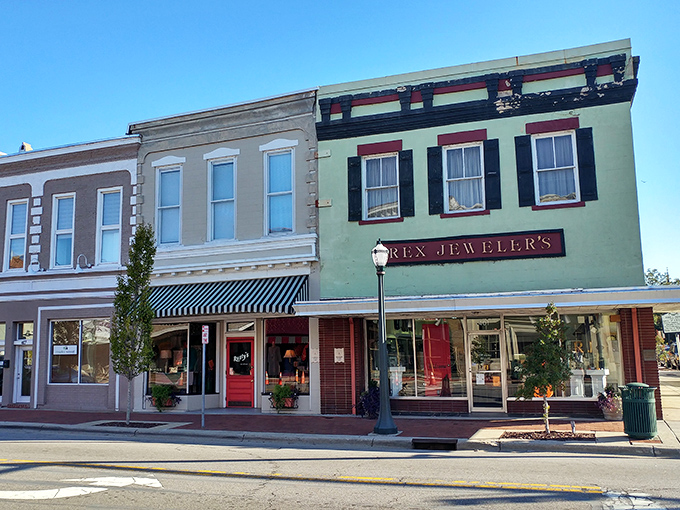 Downtown storefronts painted in heritage colors create a visual rhythm that's both soothing and distinctly American. Norman Rockwell would feel right at home here.