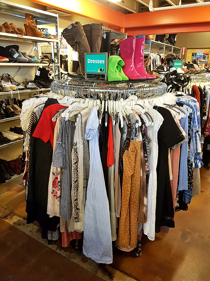 Dress central! This circular rack topped with colorful boots showcases frocks for every occasion, from casual Sunday brunches to night-on-the-town adventures.