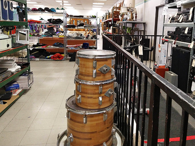 A drum set stands sentinel near the electronics section. These percussion pieces are just waiting for their next garage band revival or parent's noise-canceling headphone purchase.