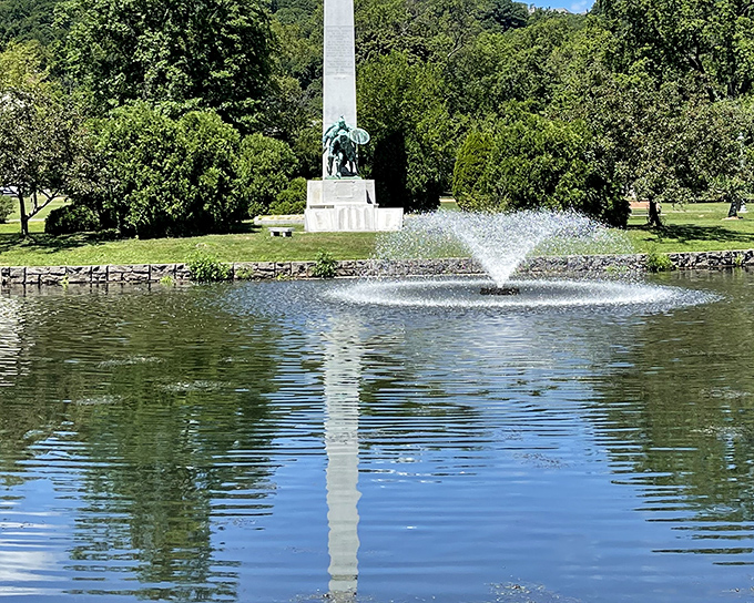 Edgemont Park's serene pond and monument create a reflective oasis in the heart of town. Nature and history, perfectly framed.