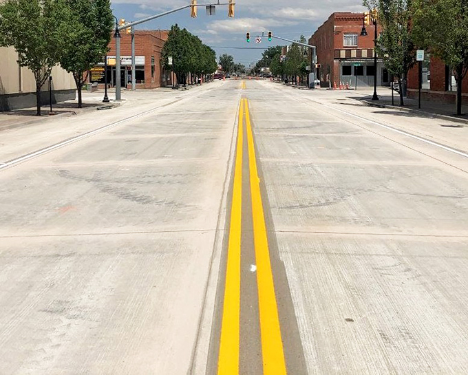 Edison Street stretches toward the horizon with that distinctive small-town emptiness that either terrifies or liberates you completely.