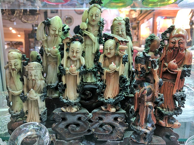 Asian figurines carved with impossible detail. Someone's collection becomes another's discovery&mdash;the beautiful cycle of antique shopping continues.