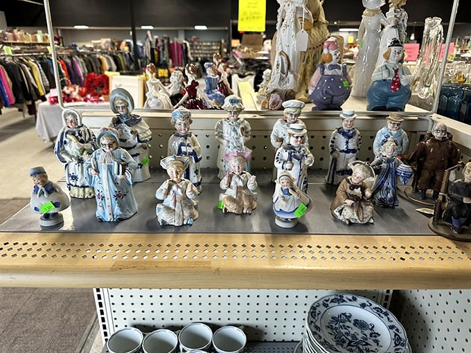 Porcelain figurines stand in formation, awaiting new mantels to grace. These dainty time travelers from grandma's era bring vintage charm at prices that won't break your piggy bank.