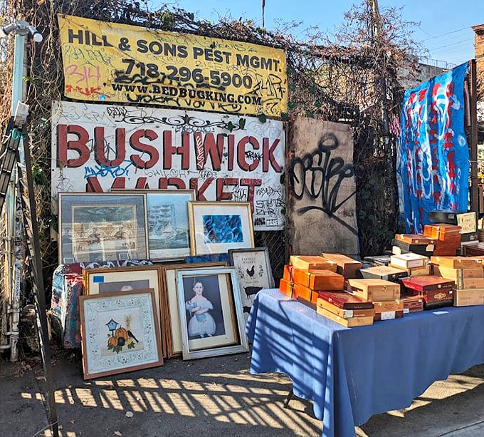 The market's signature wall stands as Brooklyn's own gallery entrance. Art and authenticity collide under that perfectly weathered Bushwick Market sign.
