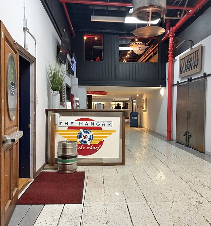 The entrance doesn't just welcome you&mdash;it sets the stage for the experience ahead. That logo promises aviation history with your seafood.