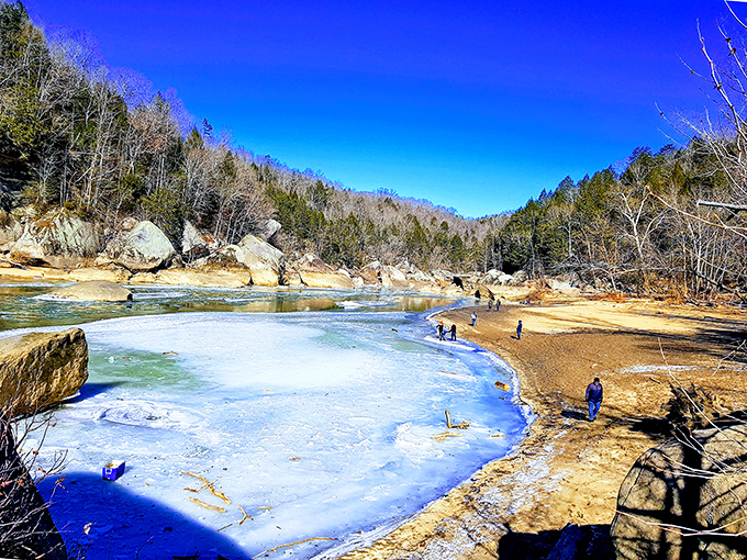 Winter occasionally transforms Cumberland Falls' edges into a crystalline wonderland, where visitors brave the cold for views most never see.