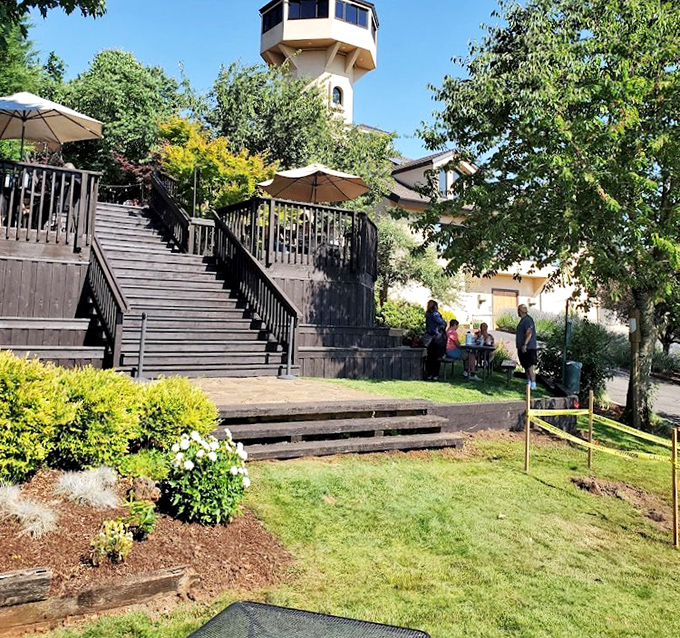 Landscaped gardens and wooden walkways create enchanting pathways between tasting rooms and scenic overlooks.