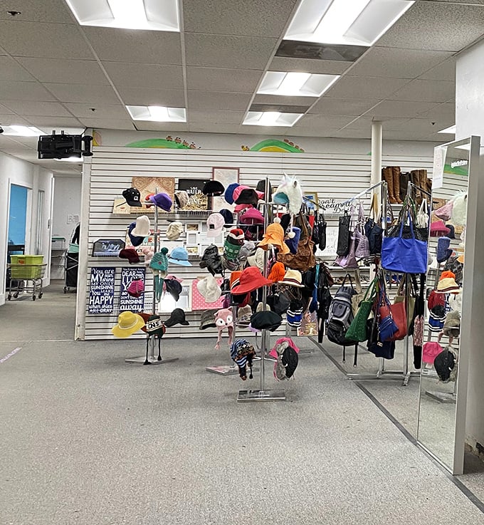 The hat wall – a dizzying display of headwear options from practical to whimsical – proves that Global Thrift truly has you covered from head to toe.