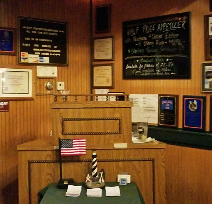 The host station, adorned with awards and maritime touches, stands as the gateway to seafood paradise&mdash;where the only password needed is an appetite.