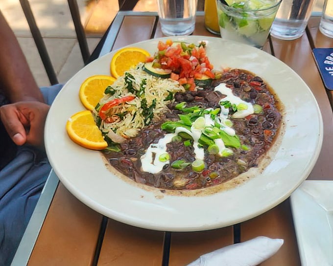 Feijoada&mdash;Brazil's soul-warming black bean stew&mdash;arrives like a painting on a plate, with rice, oranges, and greens providing perfect accompaniment.