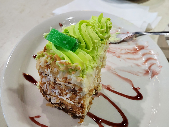 This key lime cheesecake, with its vibrant green top and coconut-crusted sides, is the dessert equivalent of a tropical vacation.